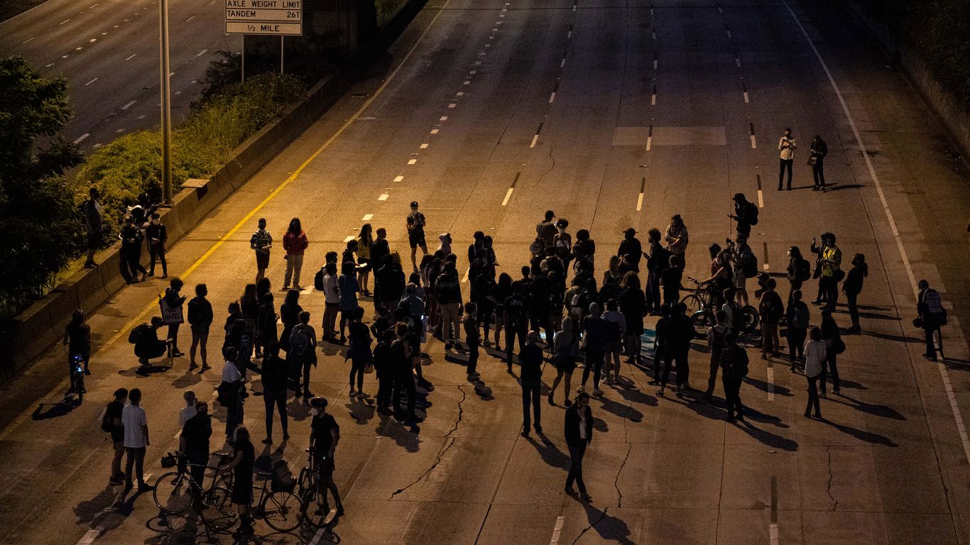 Protester dies after car drives through closed highway in Seattle