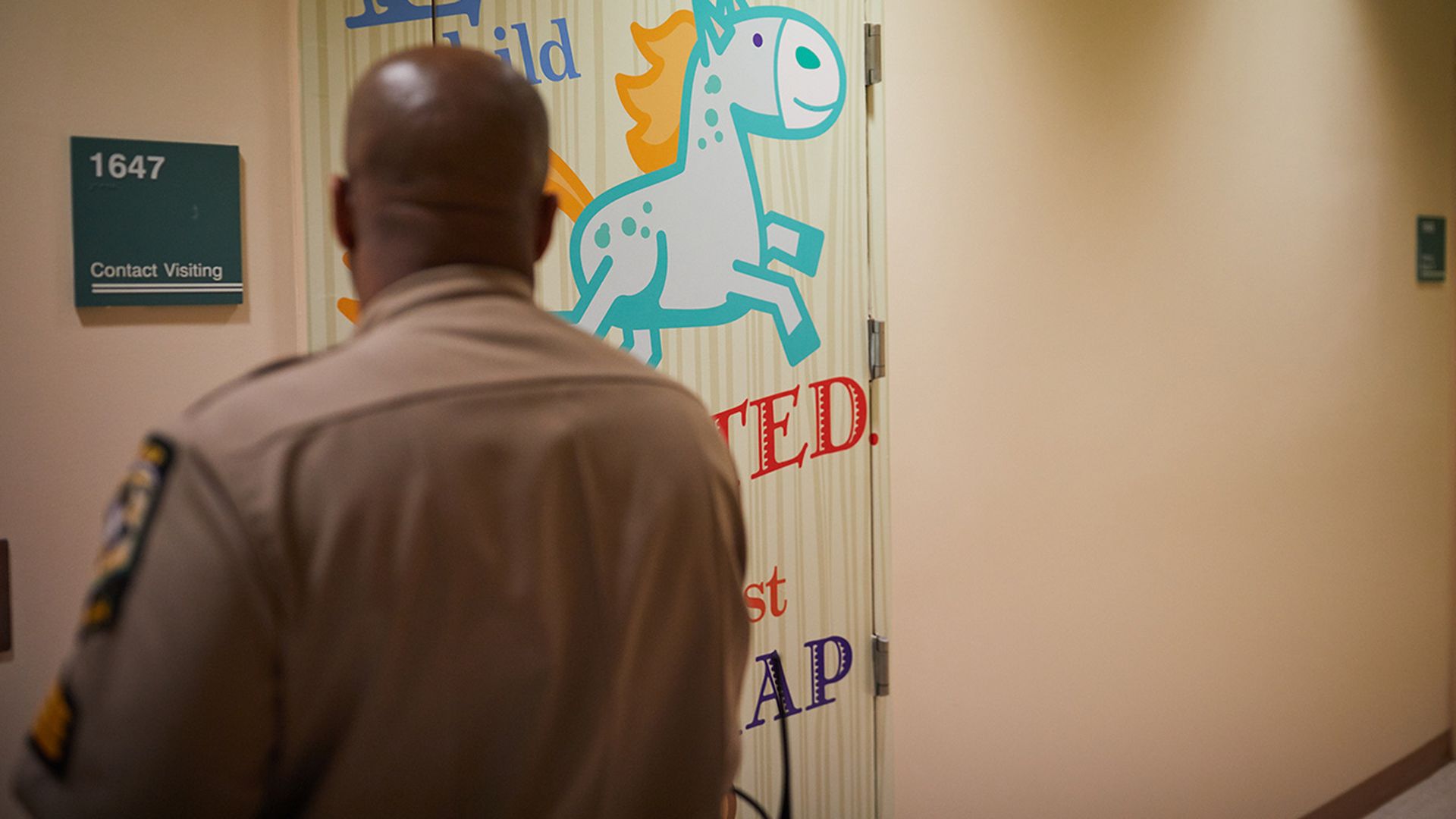 Behind a door with a teddy bear on it, inmates reconnect with their ...