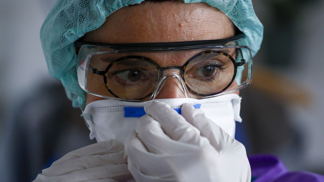 COVID: WHO pandemic declaration, one year on — photos