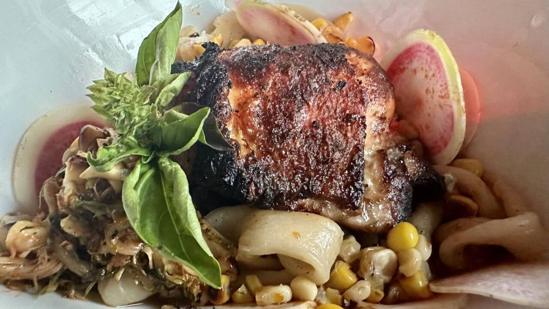 Best thing we ate in New Orleans: Chicken thigh at suis generis - Axios ...