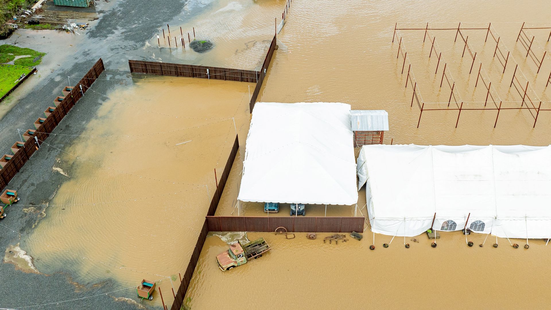 Photos: California atmospheric river's flooding rains trigger outages