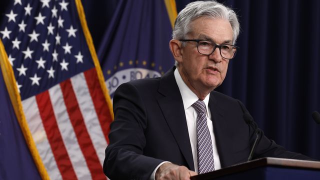 Federal Reserve holds interest rates steady, signals more hikes ahead