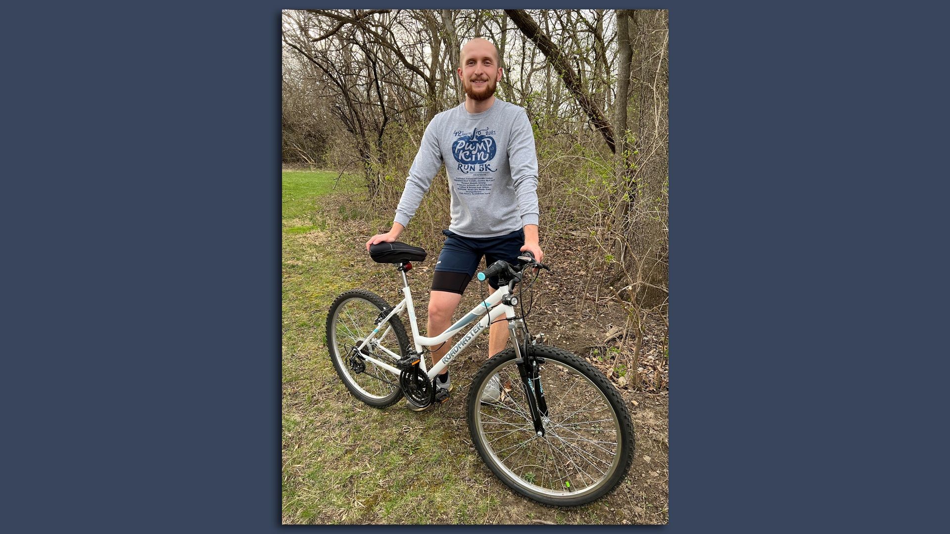 Columbus resident Jon Busch stands behind his bicycle.