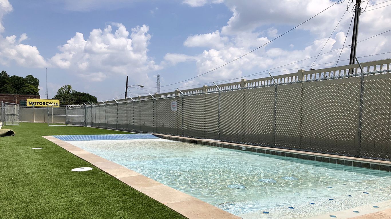 16,000-square-foot pet boarding facility with an outdoor swimming pool ...