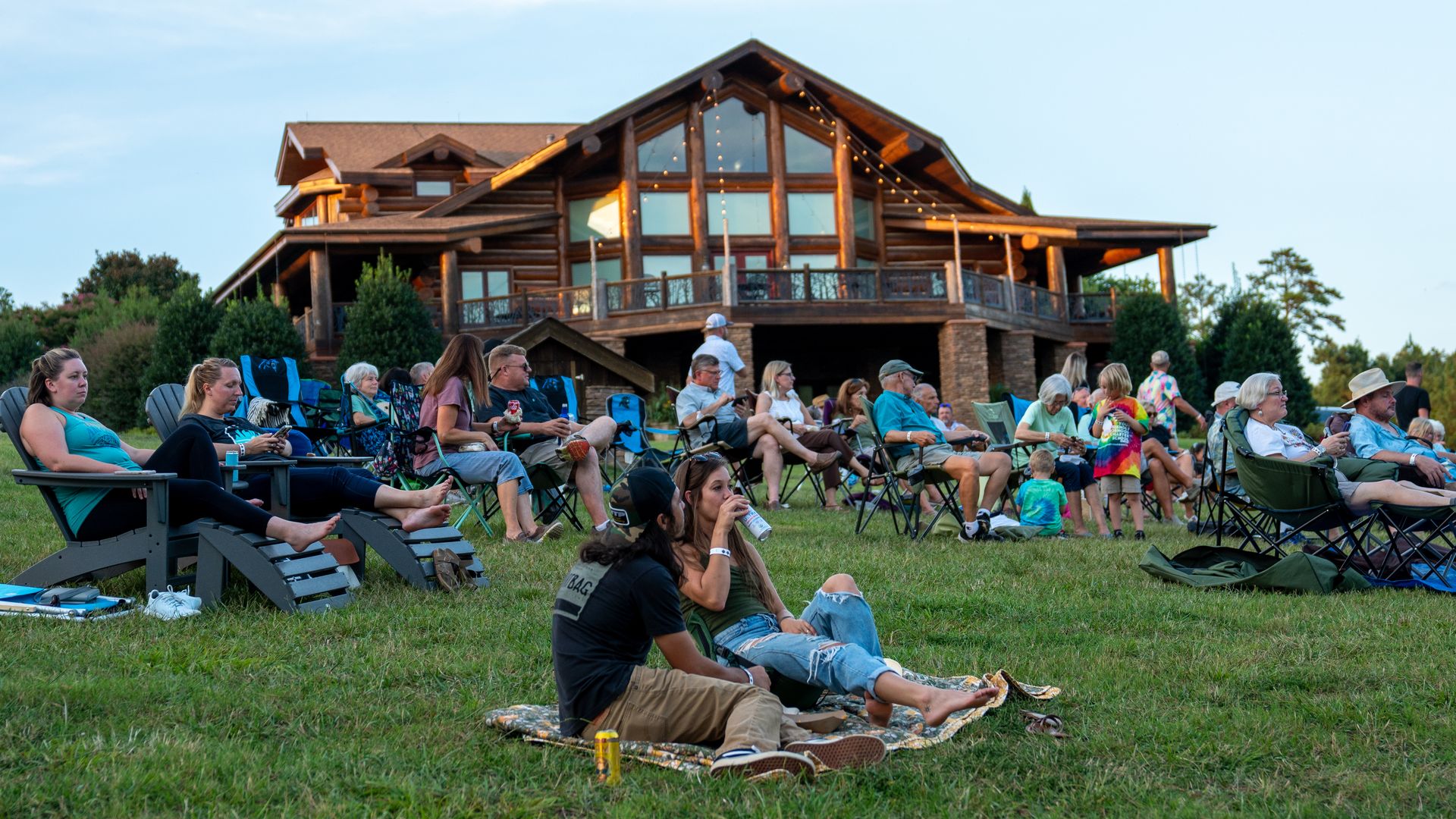 people sitting on a lawn