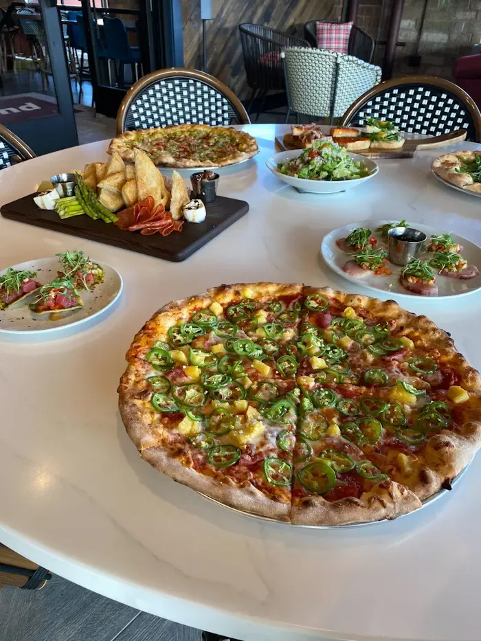 Mini-golf concept backed by Rory McIlroy now open in South End - Axios ...