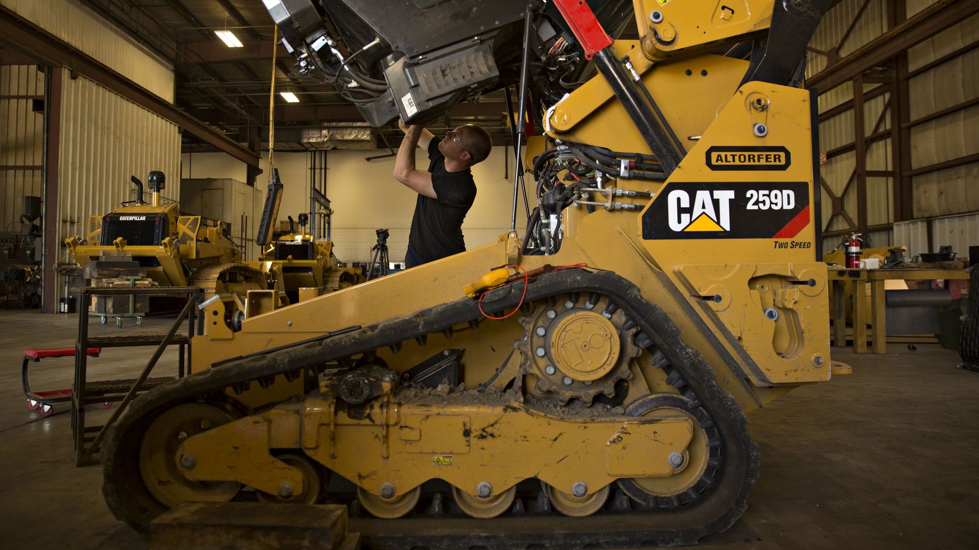 Inside Caterpillar's construction equipment technician shortage - Axios ...
