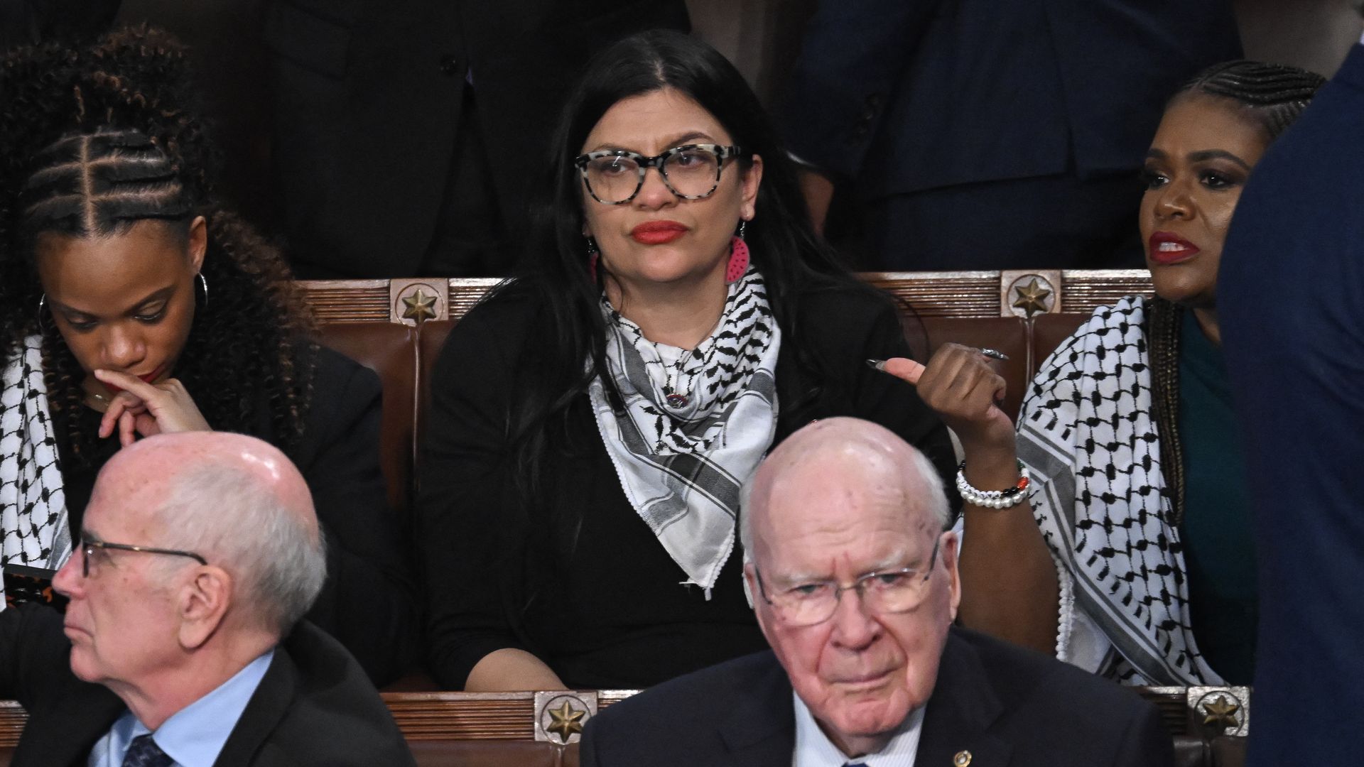 Biden gets cold shoulder from progressive "Squad" at State of the Union