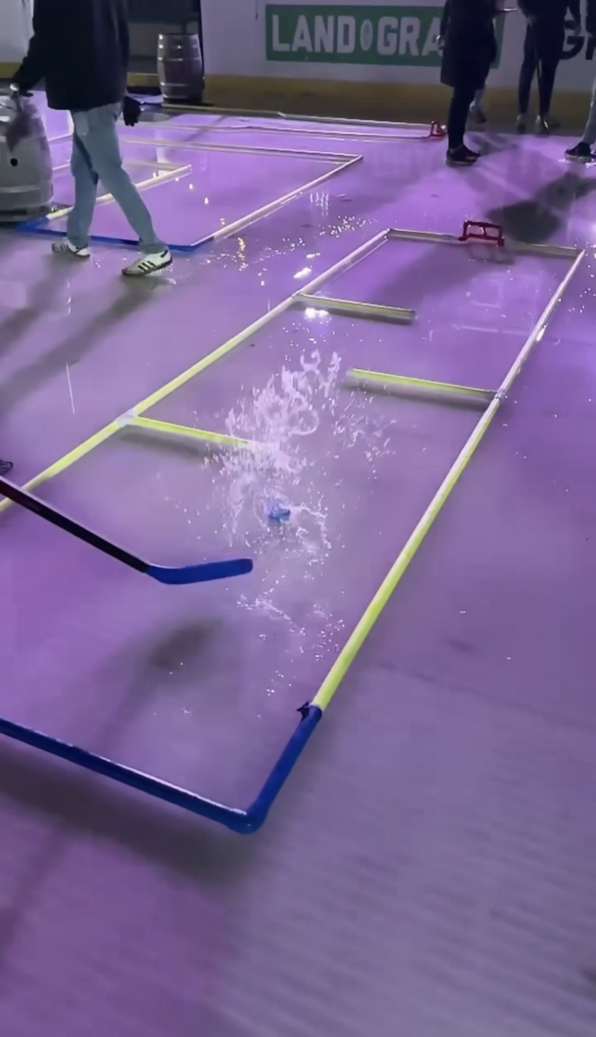 We tried Land-Grant Brewing's new "Puck-Putt" game - Axios Columbus