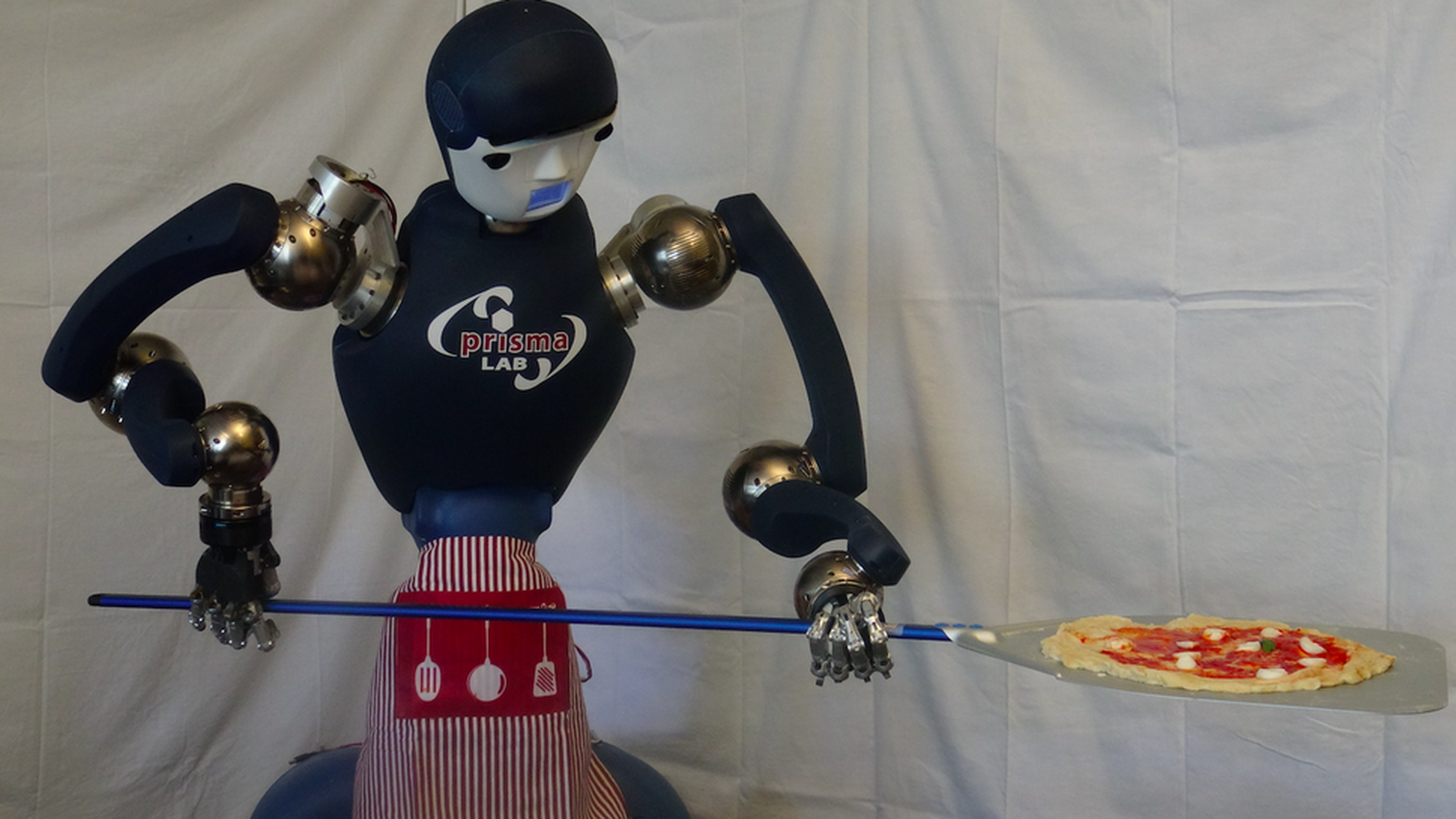 This robot chef is learning to make pizza
