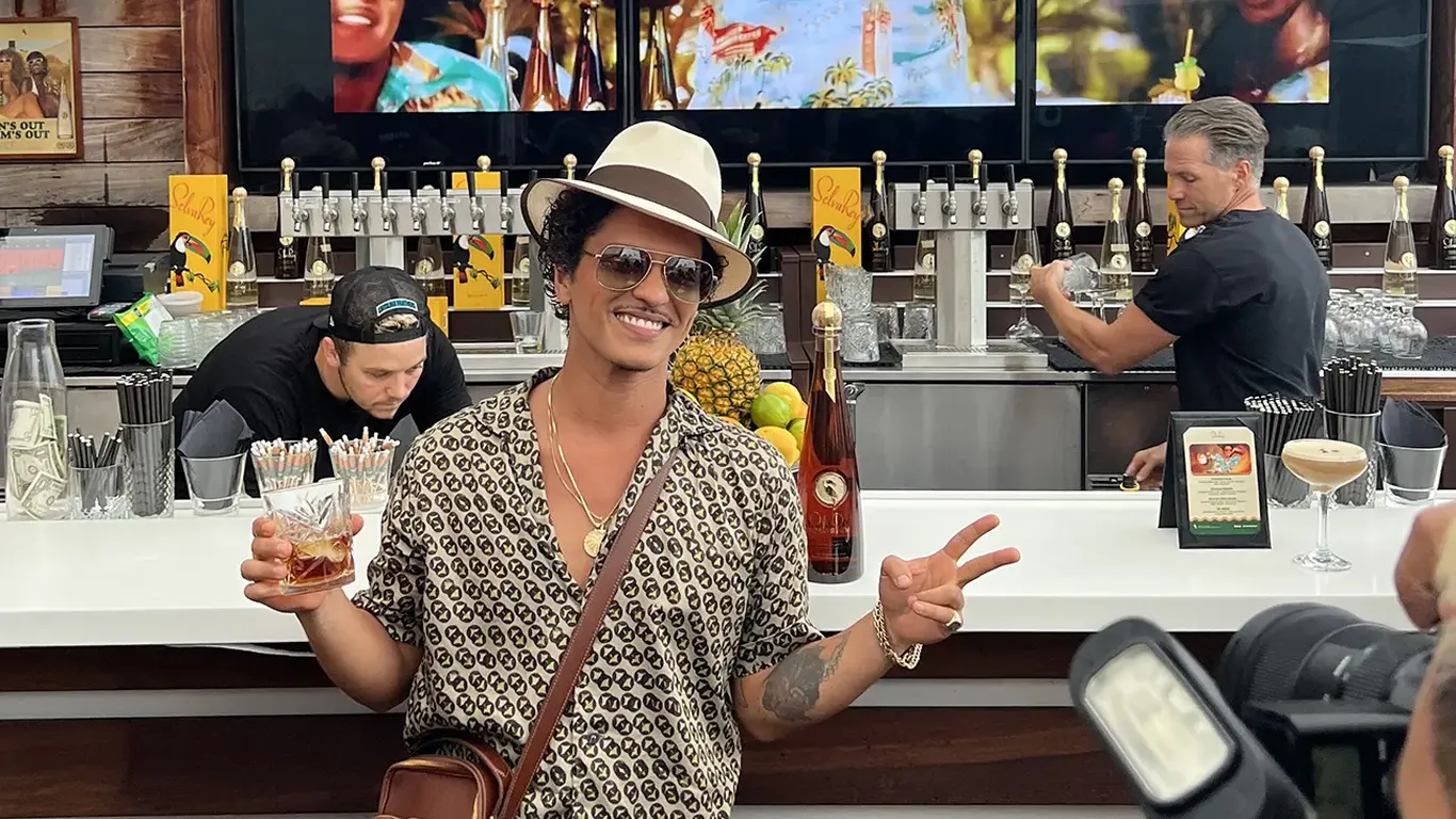 Bruno Mars tours Charlotte’s bar scene with rum brand - Axios Charlotte