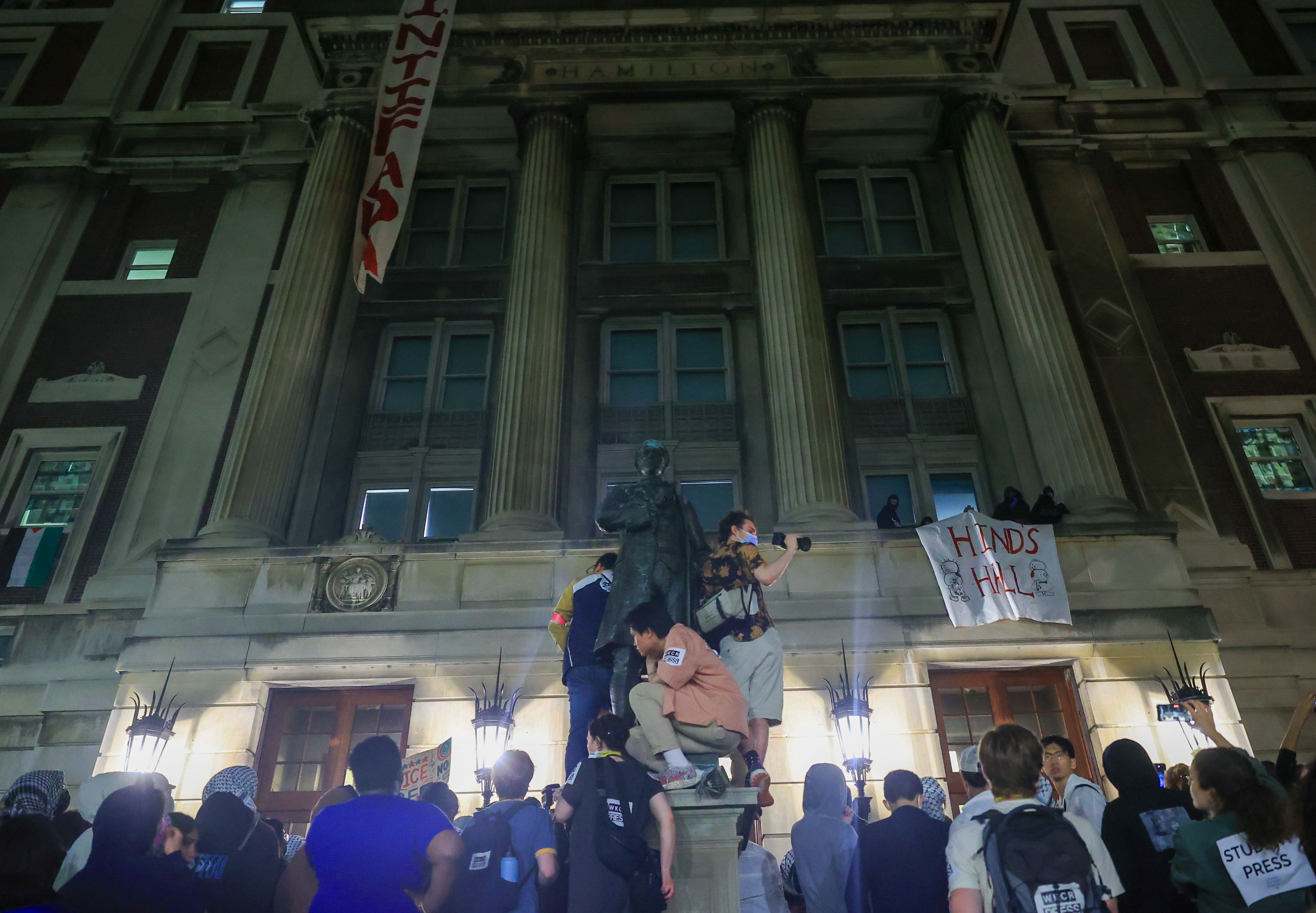 Pro-Palestinian protesters take over Columbia building, barricade doors